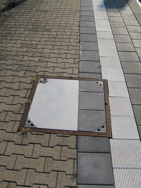 Schachtabdeckungen auspflastern | Steinhart